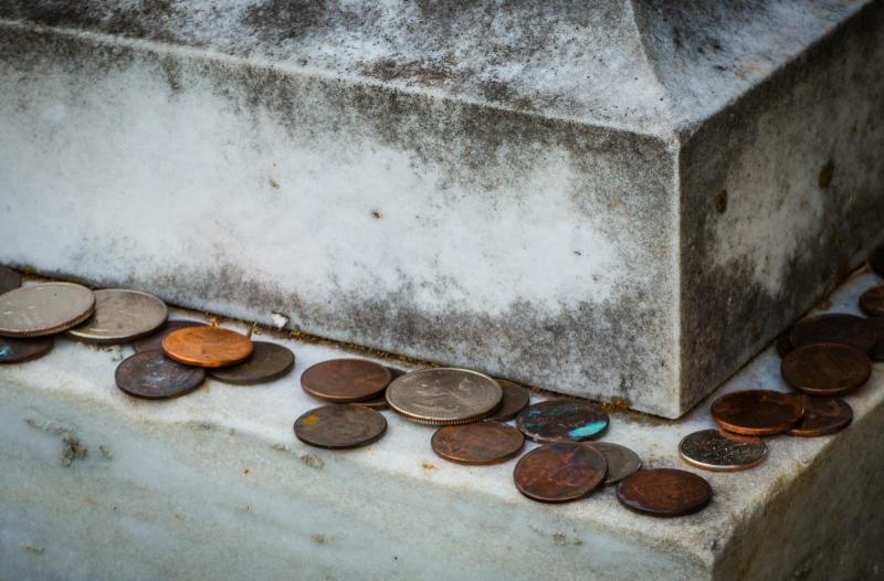 Behind the Tradition of Coins on Graves | LoveToKnow